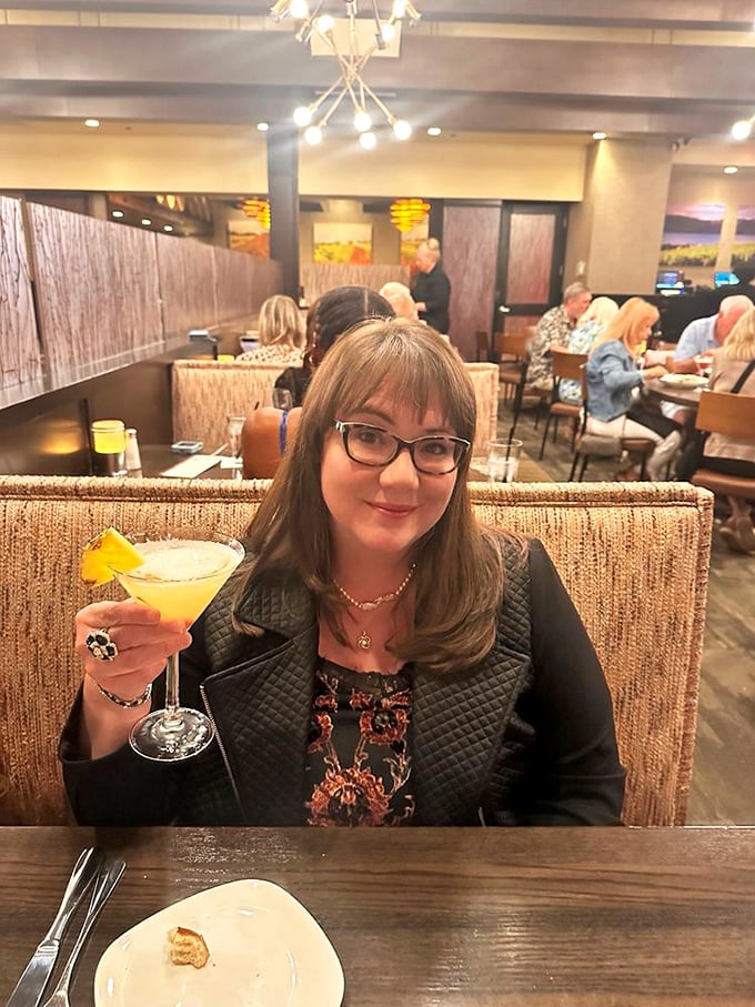 The restaurant creates the perfect backdrop for celebration. That cocktail isn't just a drink – it's liquid sunshine in a glass.