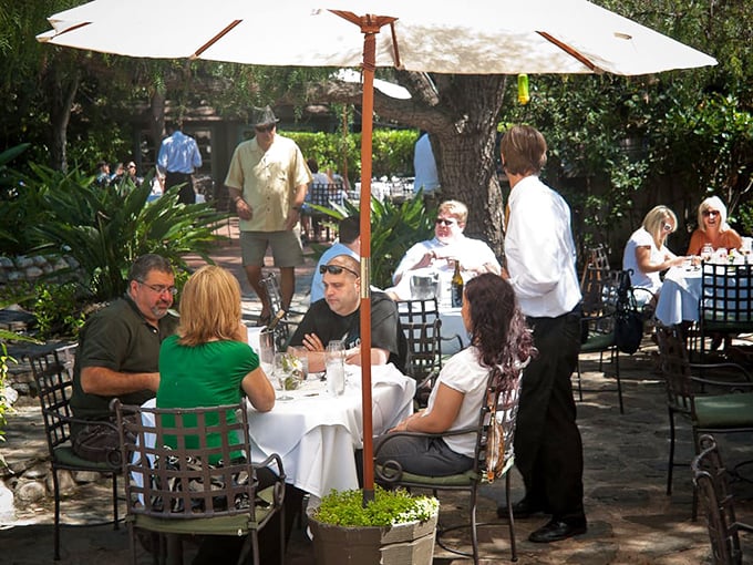 Al fresco dining where nature provides both the view and the gentle breeze. California sunshine turns lunch into a vacation moment.