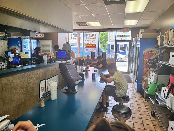 The counter at Barry's—where strangers become friends united by the universal language of "Whiz wit" and the pursuit of sandwich perfection.