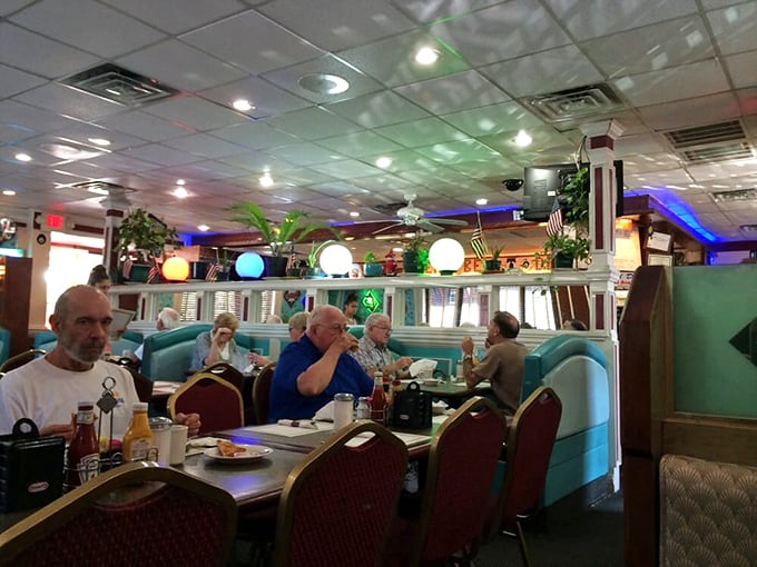 Regulars settle into their favorite spots like they're returning to their second living room, coffee mugs permanently attached.