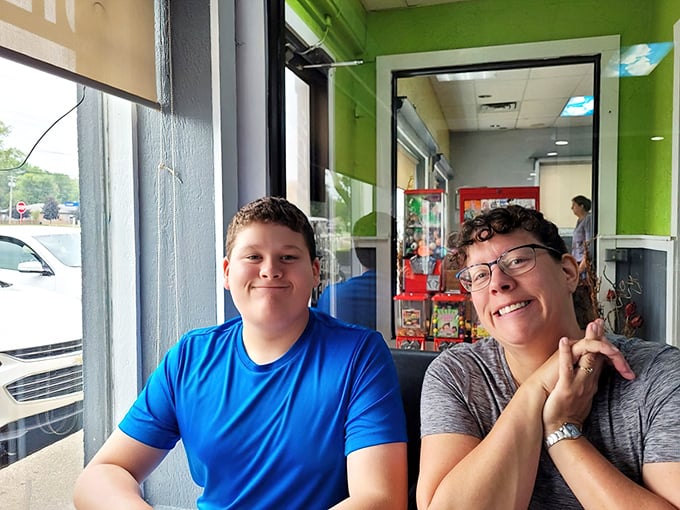 The window seats—where regulars become philosophers, solving world problems between coffee refills and bites of toast.