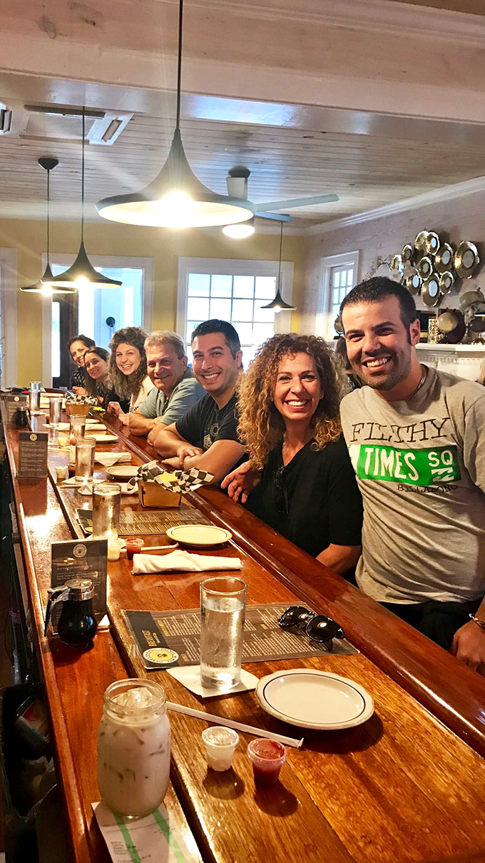 The universal language of good food brings people together—creating the kind of genuine smiles that only come from knowing you've ordered exactly the right thing.
