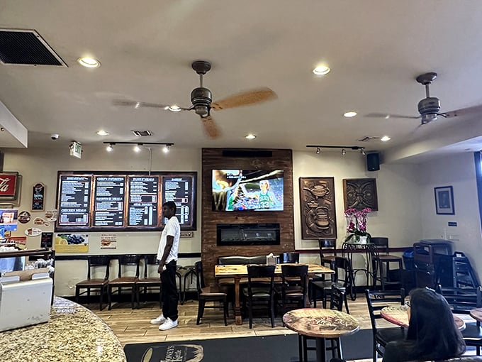 A glimpse into the dining experience where comfort food meets casual elegance – notice the fireplace that adds unexpected warmth.