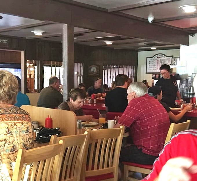 The breakfast crowd at Swing Inn—where regulars and tourists alike bond over coffee and the universal language of "pass the syrup, please."
