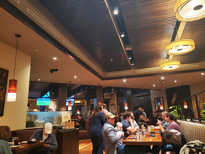 The dining room buzzes with conversation and clinking glasses – that magical restaurant energy where memories are made between bites.