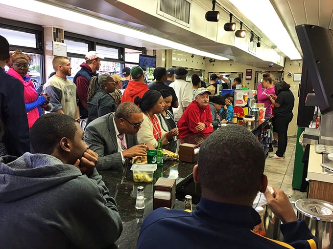 The counter scene at lunchtime—a cross-section of Philadelphia life united by the universal language of great food.