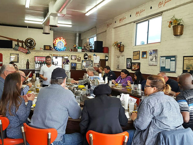 The counter isn't just full—it's a community of strangers united by the universal language of "this chili is worth the wait."