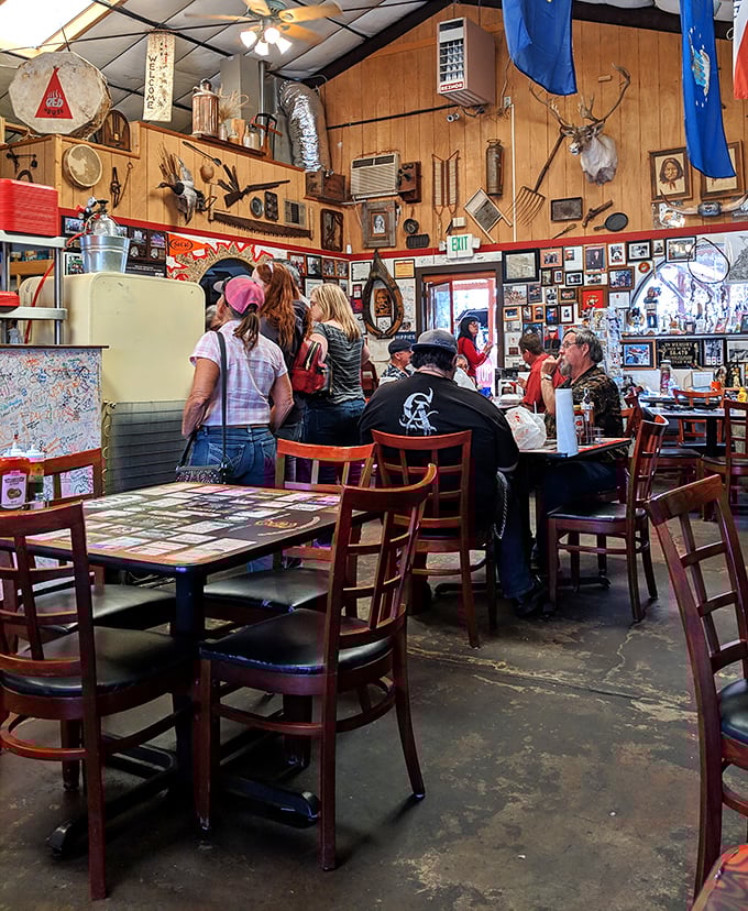 Where BBQ memories are made—wooden tables topped with business cards from satisfied customers tell stories of pilgrimages to this meat mecca.