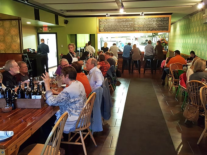 A bustling dinner service where conversations flow as freely as the wine—this is community happening around food.