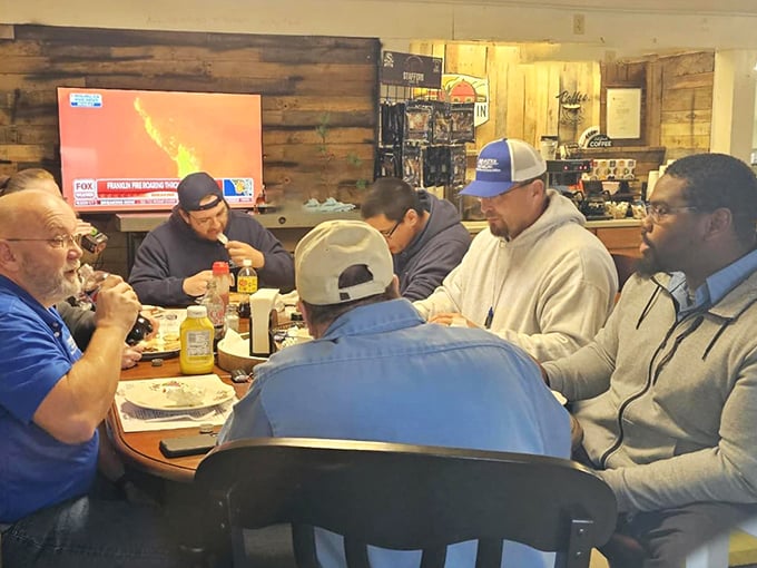 A table of regulars sharing breakfast and conversation—the true measure of any great local eatery isn't Michelin stars, but familiar faces.