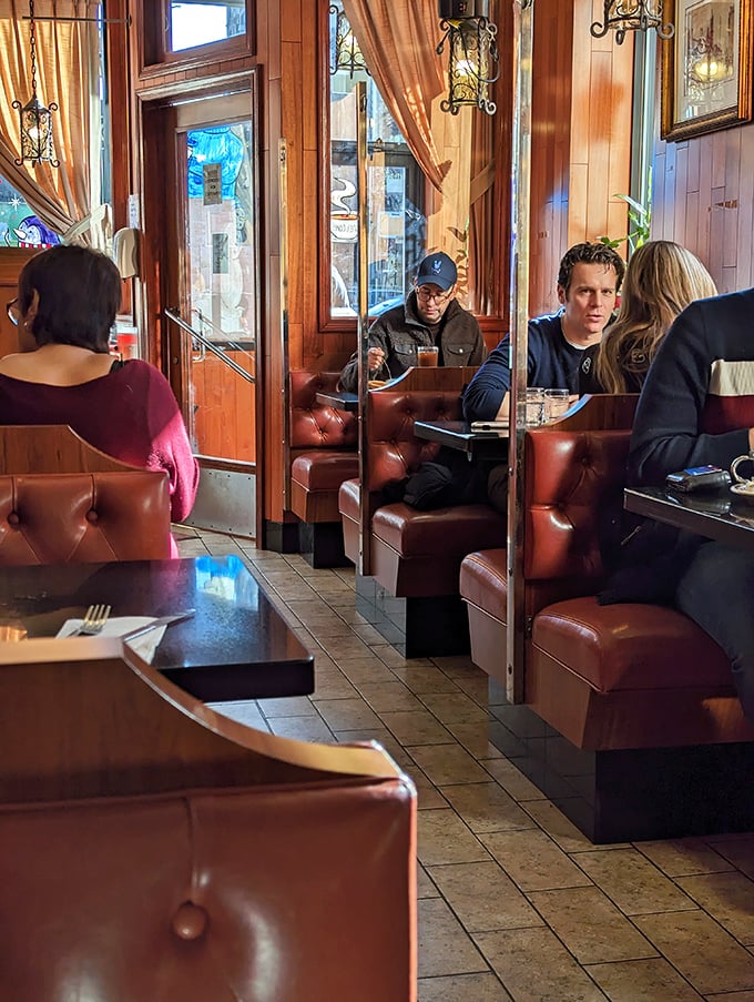 Fellow diners enjoying conversations and comfort food - this is community dining at its finest.