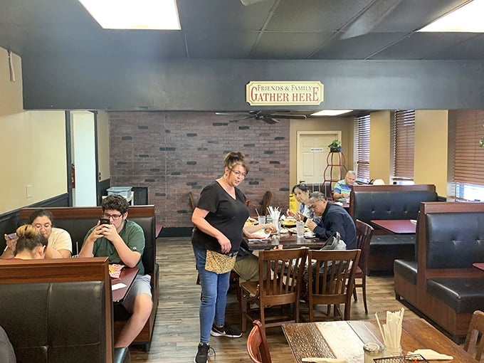 That "Friends & Family Gather Here" sign isn't just decoration—it's the most honest advertising you'll find in the restaurant business.