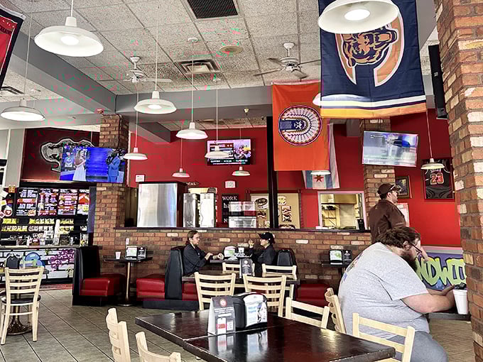 Red walls, sports flags, and plenty of seating—the kind of place where you can catch the game while catching up with your appetite.
