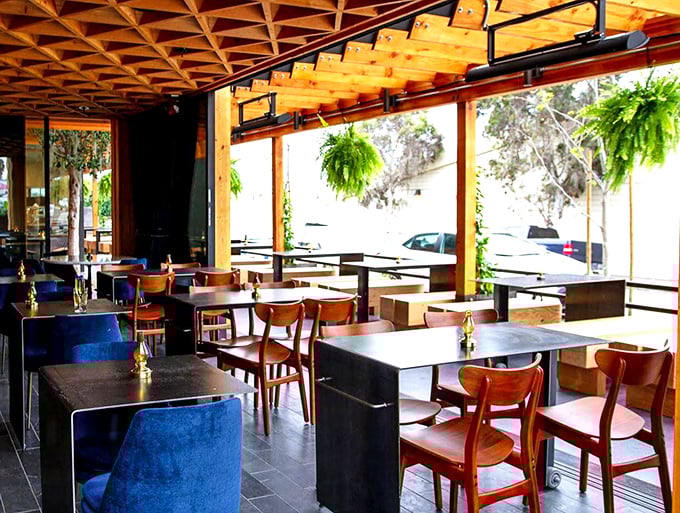 The dining area strikes that perfect balance between "nice enough for your anniversary" and "casual enough for Tuesday night gumbo cravings."