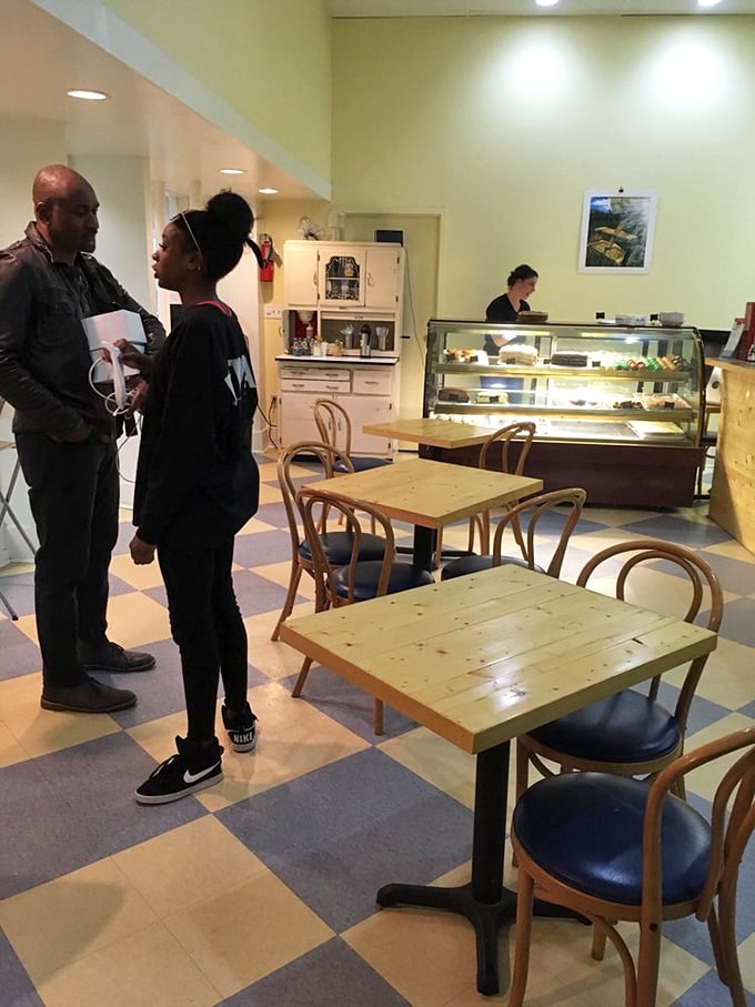 The dining area's wooden tables and classic café chairs create an atmosphere where lingering over coffee feels not just allowed, but encouraged.
