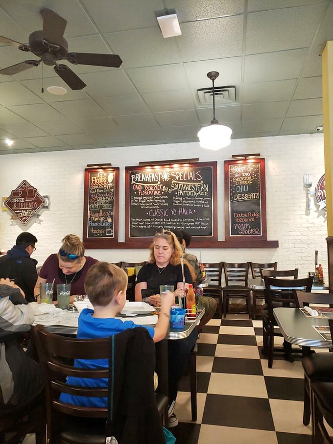 Classic black-and-white checkered floors set the stage for family meals and memory-making. Norman Rockwell would approve.