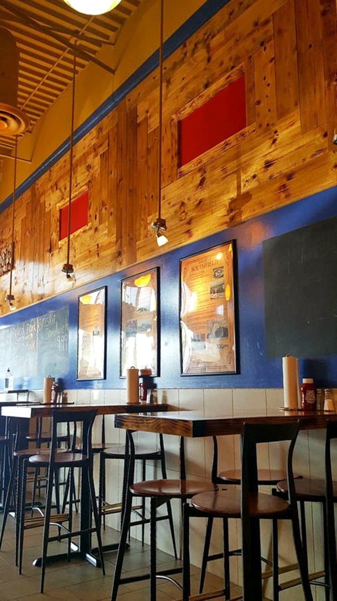 Wood paneling meets blue walls in a space that says, "We're serious about barbecue, not interior design"—exactly as it should be.