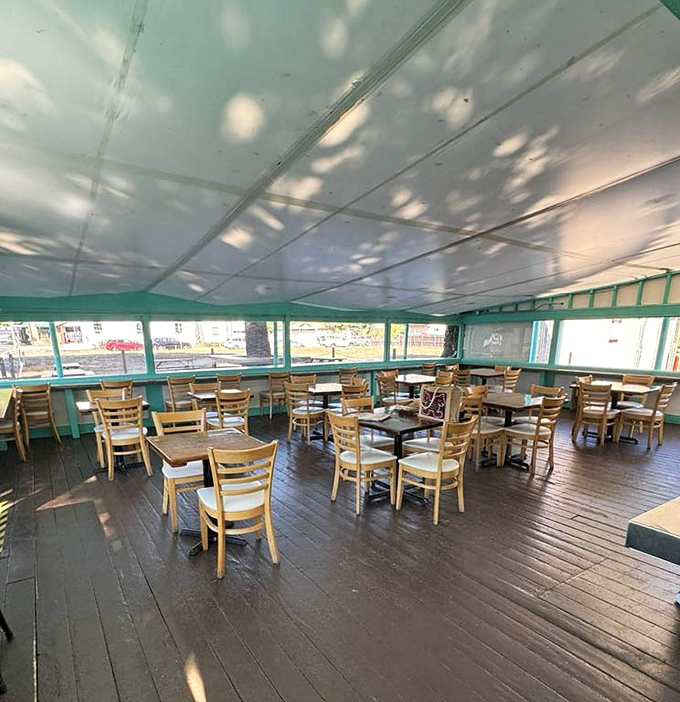 Dappled sunlight plays across wooden tables, creating nature's own Instagram filter. The calm before the delicious storm.
