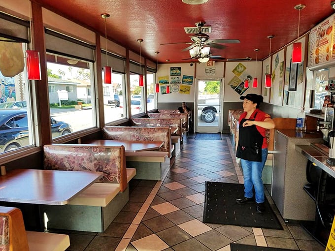 A diner interior that doesn't know it's supposed to be nostalgic—it's just being itself. The ceiling fan has witnessed thousands of first bites and satisfied sighs.