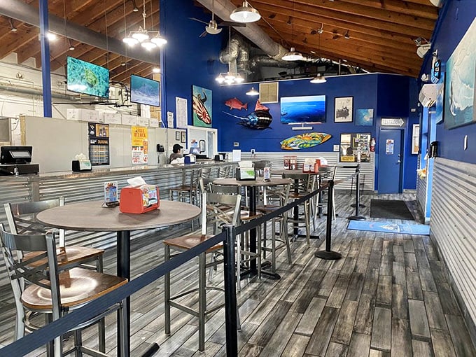 High-top tables and nautical blue walls create the perfect casual vibe. This isn't dining—it's an experience where memories are made between bites.