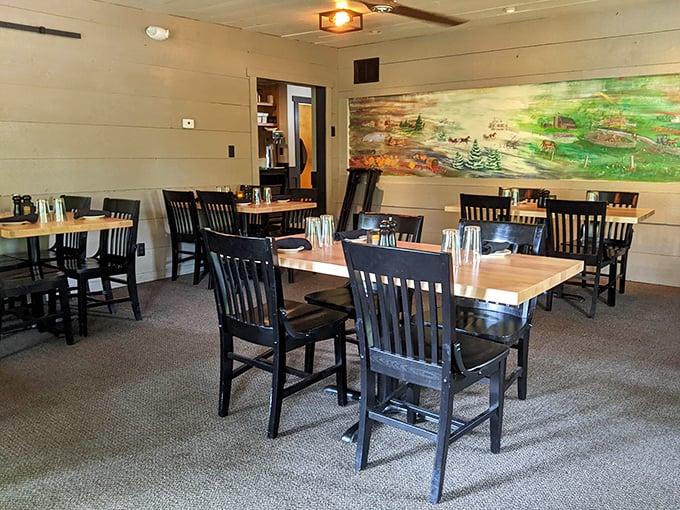 Another dining area showcases rustic charm with a pastoral mural that whispers, "Slow down, you're in Indiana now—savor the moment."