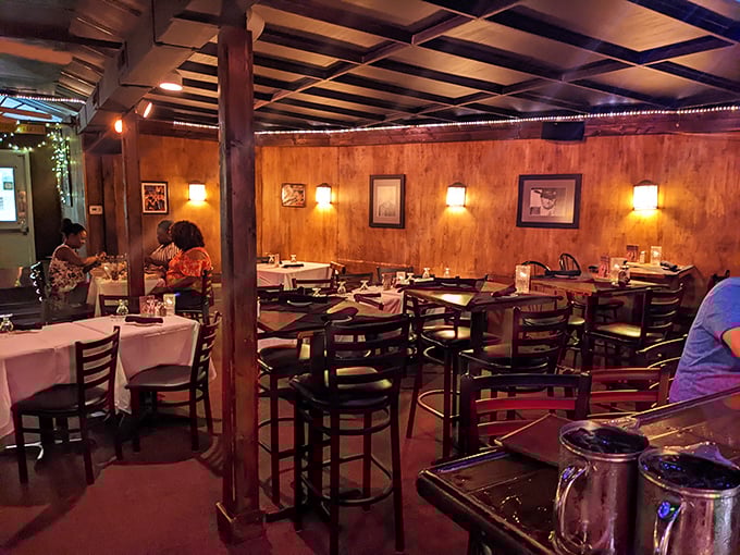 Warm lighting, wood beams, and white tablecloths create that rare atmosphere where you instantly know you're about to experience something special.