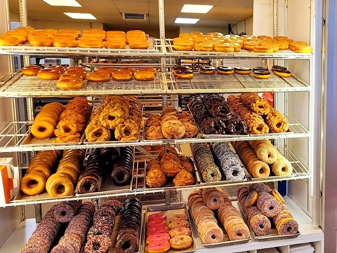 The donut display case—where dreams are stacked in neat rows and willpower goes to die.
