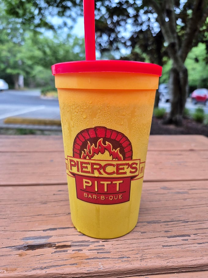 That yellow cup isn't just holding a beverage—it's containing liquid joy to wash down smoky perfection.