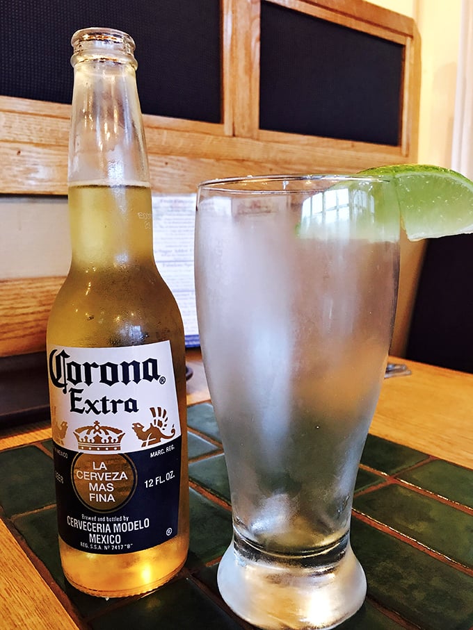 Nothing complements coastal dining like an ice-cold Corona with lime—the universal signal that vacation mode is officially activated.