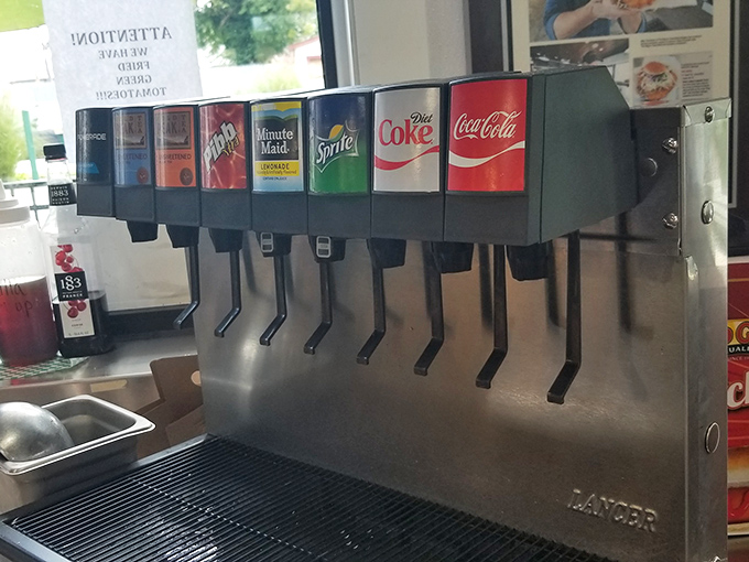 The ordering counter—where dreams become reality and hunger meets its match. That pig logo silently promises delicious things are about to happen.