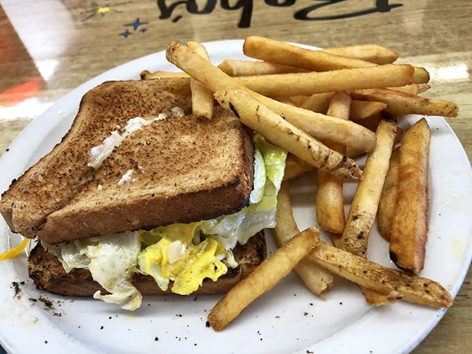The breakfast sandwich that makes all others look like underachievers. Those golden fries aren't sidekicks – they're co-stars in this morning masterpiece.