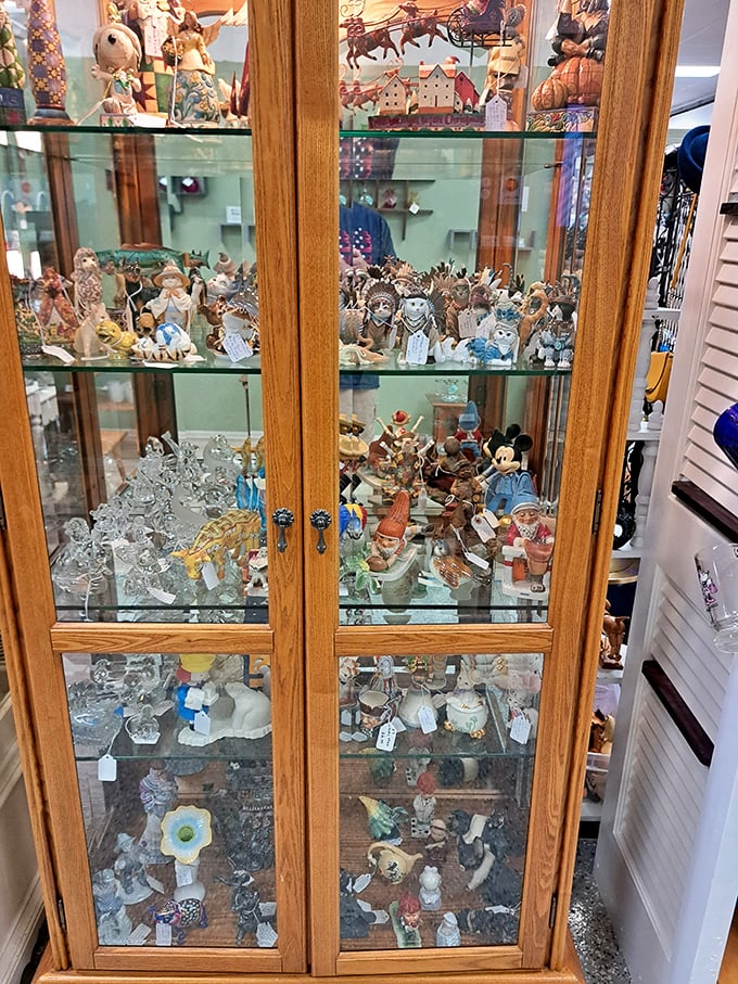 Behind glass doors, an army of figurines stands at attention. From Disney characters to delicate porcelain animals, each tiny face tells its own story.
