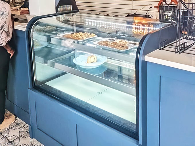 The display case doesn't just hold desserts—it's a glass-enclosed museum of "why wait until after dinner?" temptations.