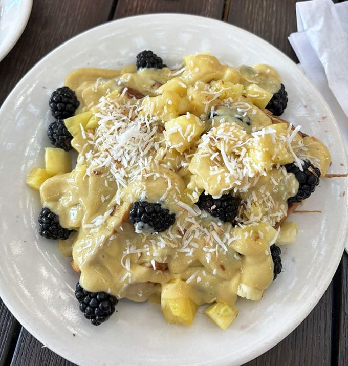 This isn't just breakfast – it's a tropical treasure of fresh fruit, custard, and berries that makes you wonder why you ever settled for cereal.