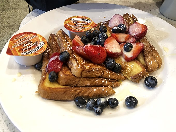 French toast adorned with fresh berries – proof that sometimes the simplest pleasures are the most effective antidotes to life's complications.