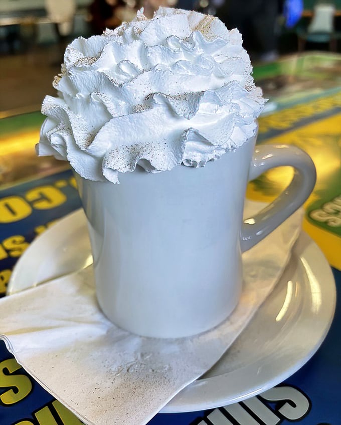That mountain of whipped cream turns a simple hot beverage into a celebration in a mug.