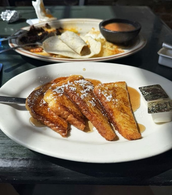 French toast that's achieved the perfect golden-brown exterior while maintaining that custard-like center—the breakfast equivalent of winning the lottery.