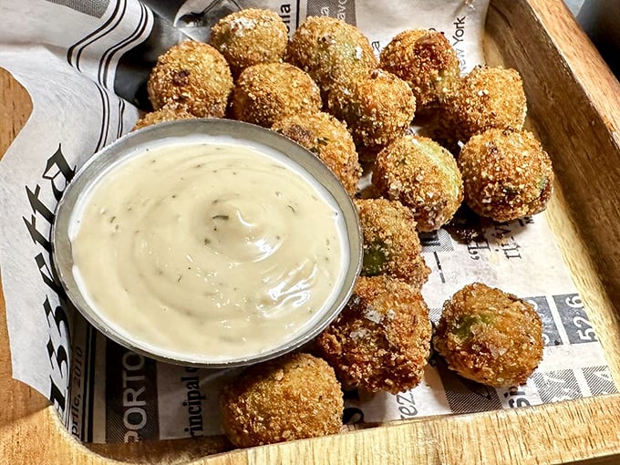 Fried olives—the cocktail snack that ruins all other bar foods. One bite of these crunchy, briny spheres and pretzels will forever seem like punishment.