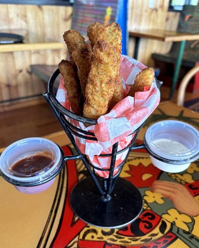 These aren't just fried pickles—they're the restaurant's namesake standing tall and proud. Served in a metal cone like the flavor torches they are.