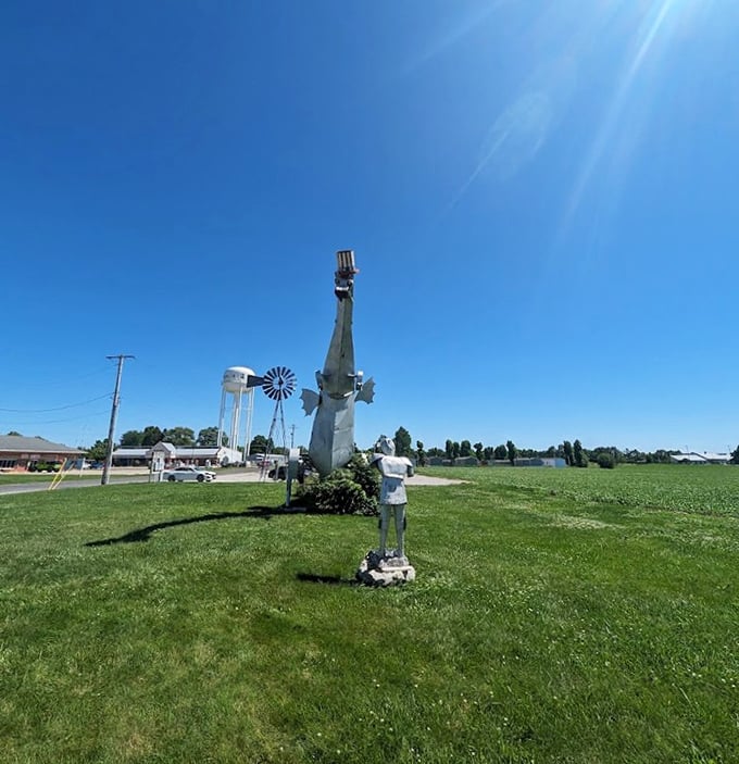 A classic American roadside scene: water tower, windmill, and fire-breathing dragon—one of these things is not like the others.