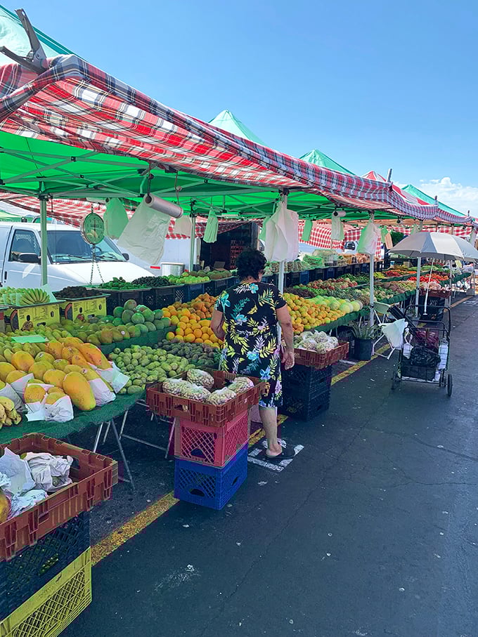 Nature's candy store! This produce stand bursts with colors so vibrant you can practically taste the freshness from ten feet away.