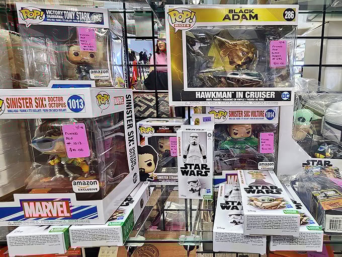Pop culture immortalized in vinyl figurines – where Marvel, Star Wars, and DC heroes battle for shelf space instead of galactic domination.