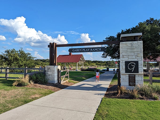 Garey Play Ranch welcomes visitors with limestone pillars and Texas-sized hospitality—the kind of entrance that says "y'all are gonna love this place."