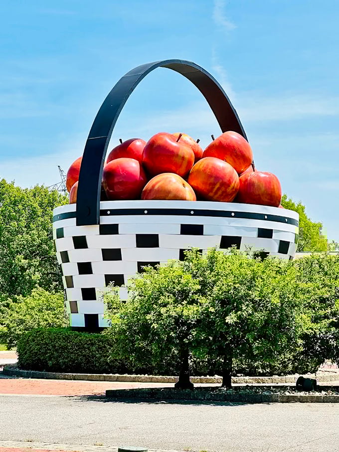 Sunlight plays across the basket's intricate weave pattern, highlighting the craftsmanship behind this monumental piece of Americana.
