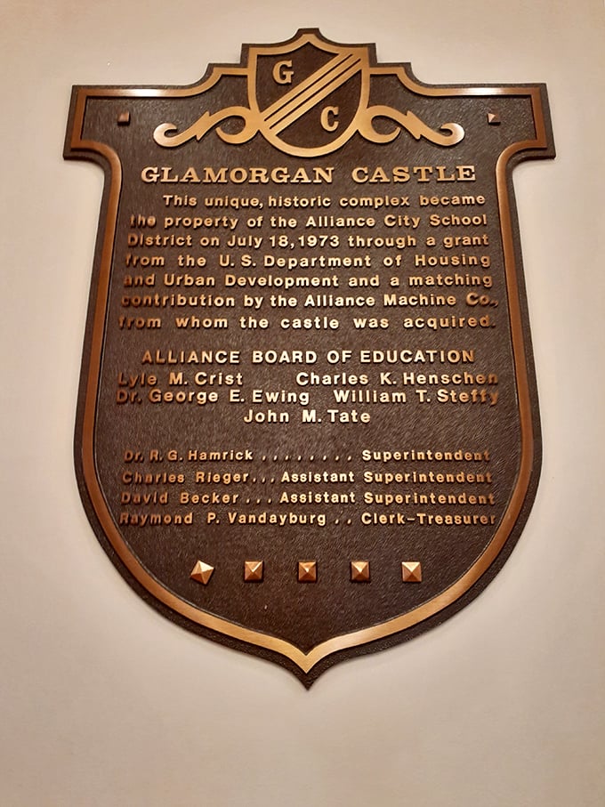 The castle's commemorative plaque reveals its second act as Alliance's most distinguished school administration building—homework has never been so grand!