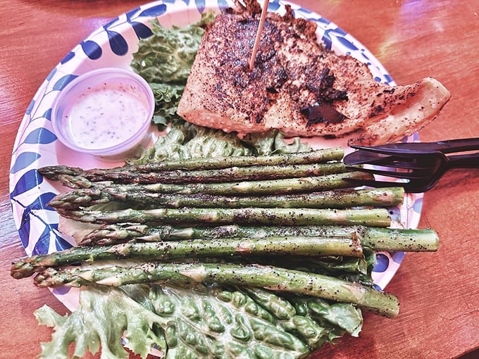 Grilled salmon and asparagus—the dish you order to feel virtuous, then realize it's so good that virtue had nothing to do with your decision.