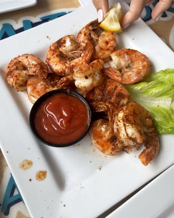 These grilled shrimp, kissed by flame and seasoned to perfection, make a compelling opening act before the crab cake main event.