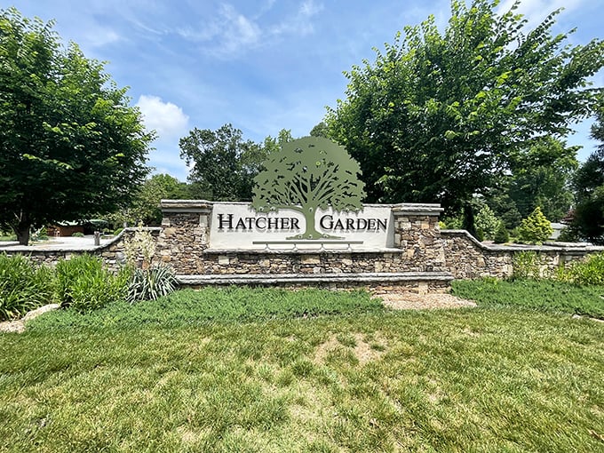 Hatcher Garden's stone entrance promises botanical delights beyond—a peaceful sanctuary where the only thing growing faster than the plants are the friendships.