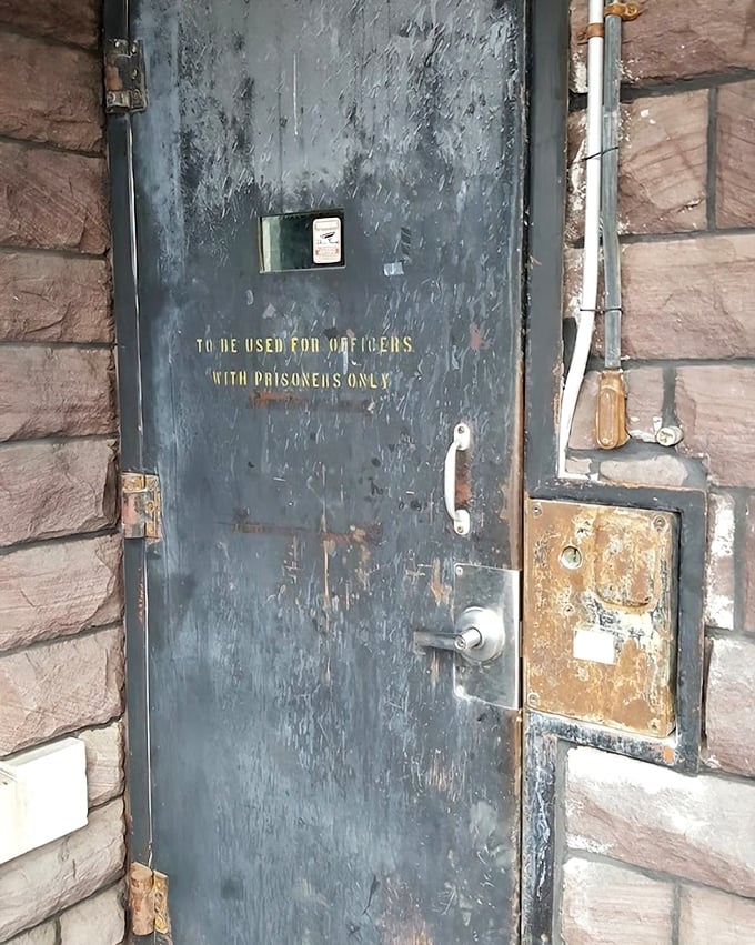 "To be used for officers with prisoners only"—this weathered door's stern warning hints at the strict protocols that governed every aspect of jail operations.