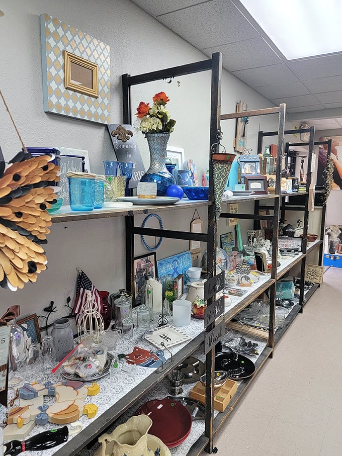 Curated chaos at its finest—shelves of glassware, frames, and knickknacks await their second chance to shine in someone's carefully styled bookcase.
